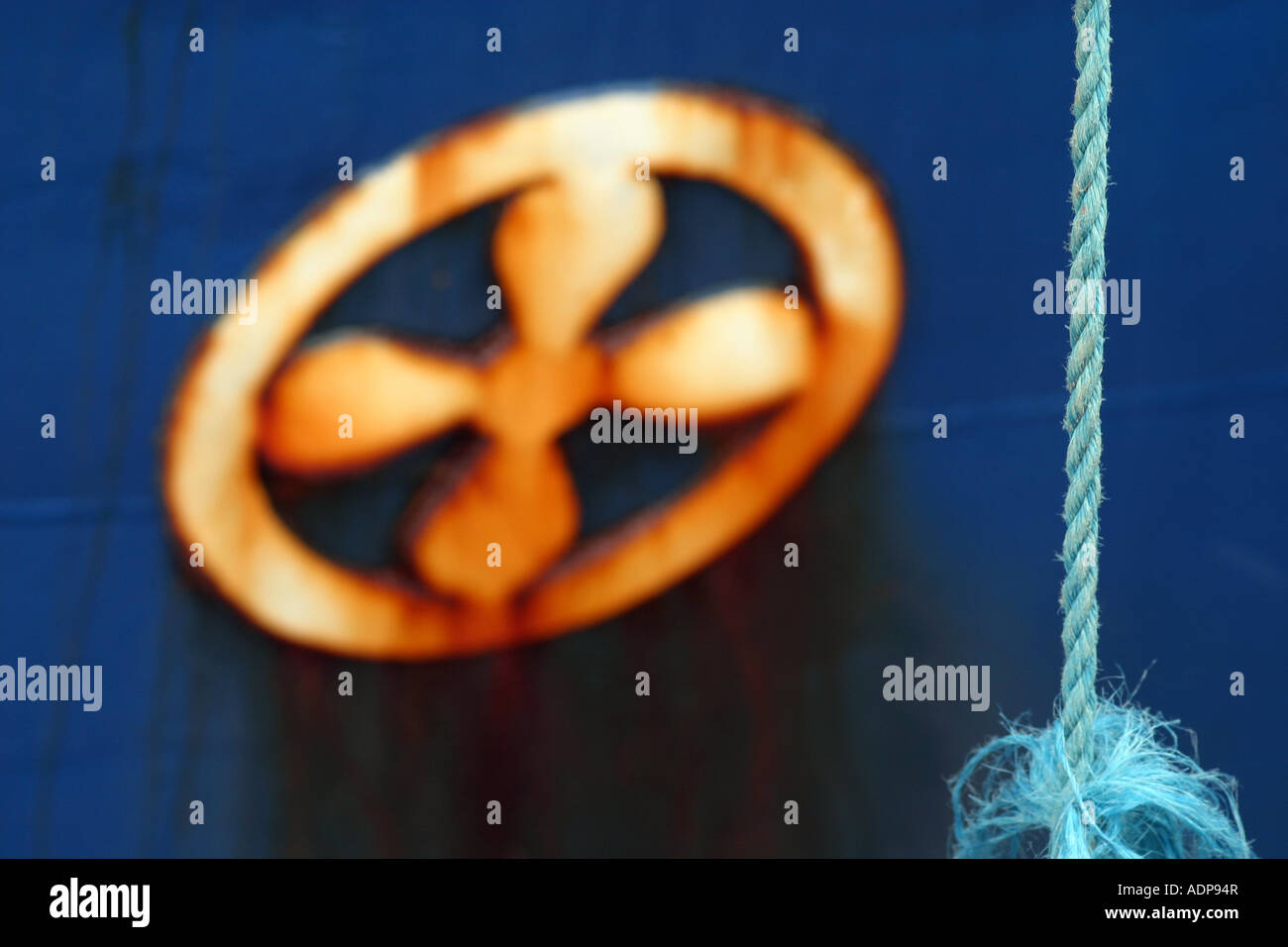 Propeller symbol on fishing trawler with blue rope in foreground Stock ...