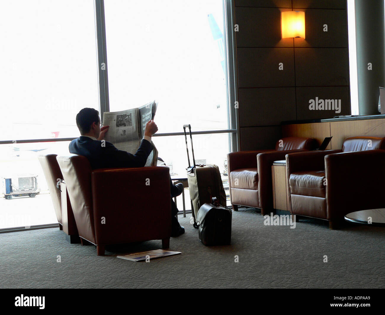 Business Traveler in Airport VIP Waiting Room Stock Photo - Alamy