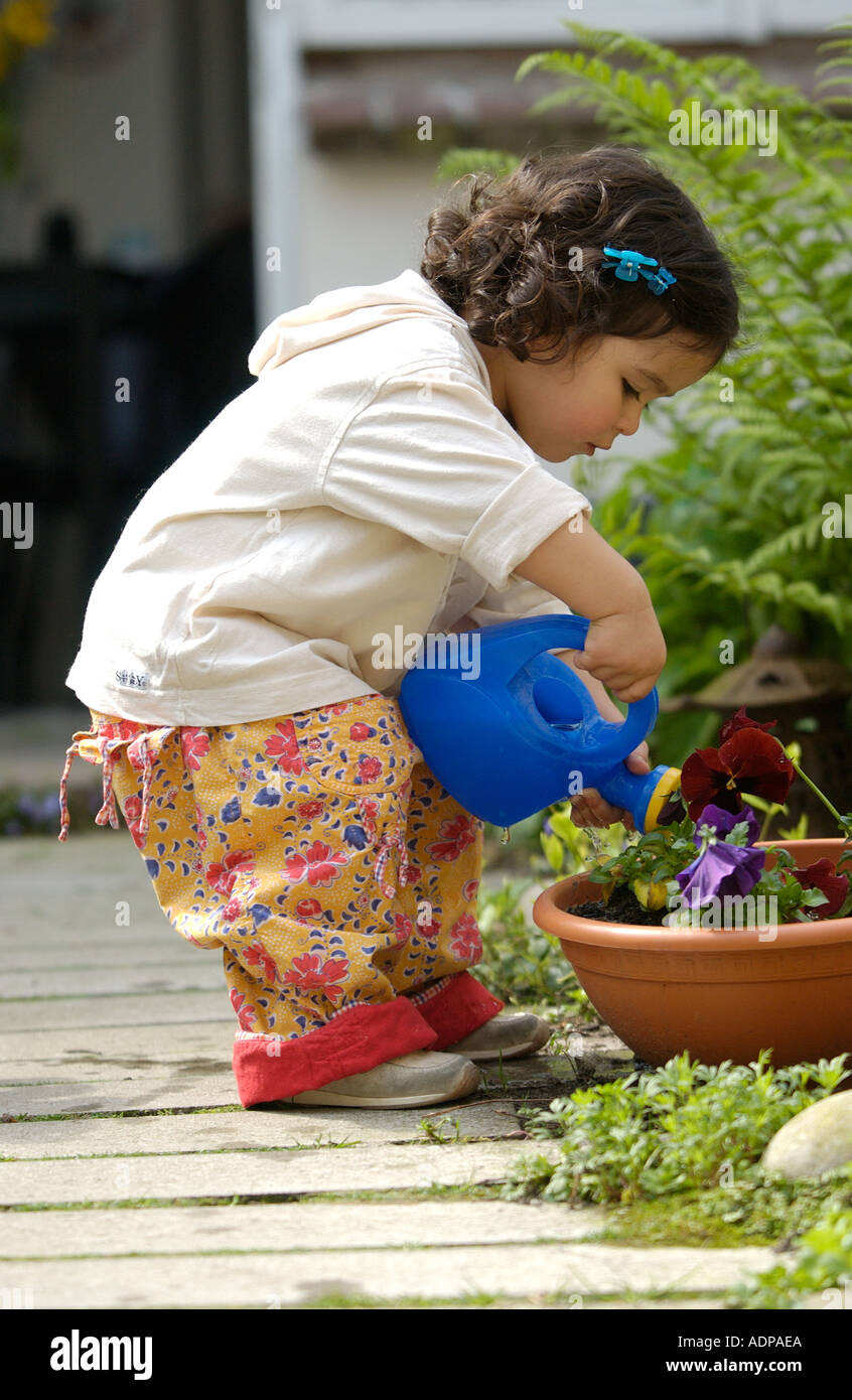girl pouring water Stock Photo - Alamy