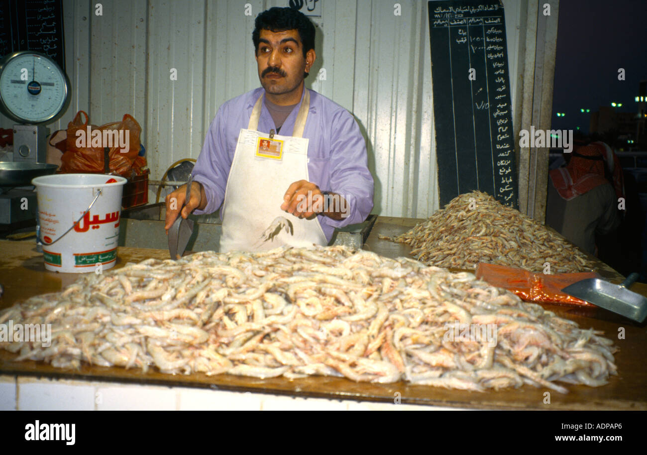 Kuwait City Kuwait Kuwaiti Man At The Fish Souk Selling Prawns Stock ...