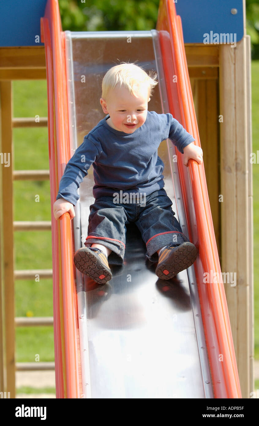 Little boy on slide Stock Photo - Alamy