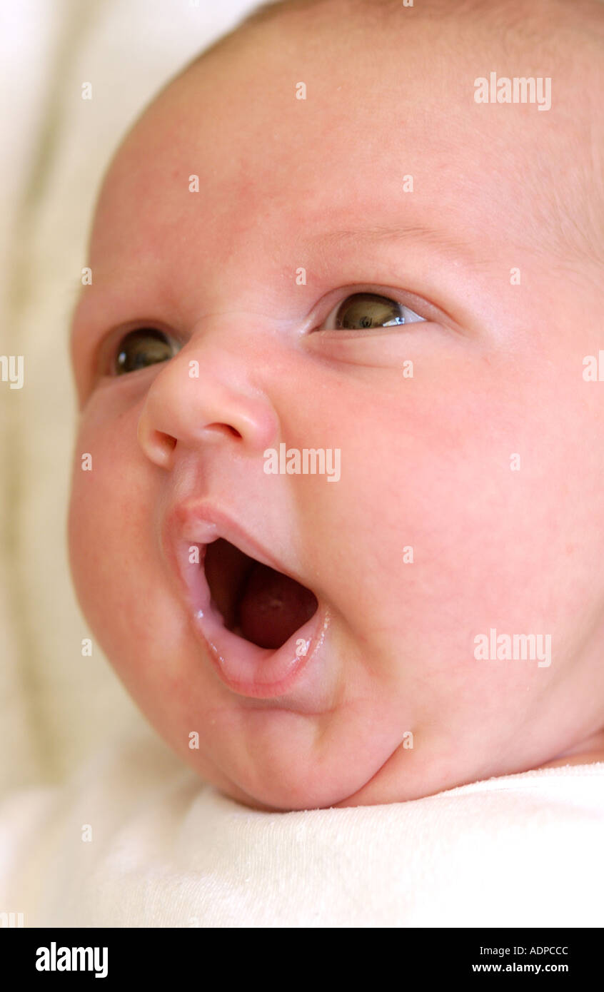 Yawning baby portrait Stock Photo - Alamy