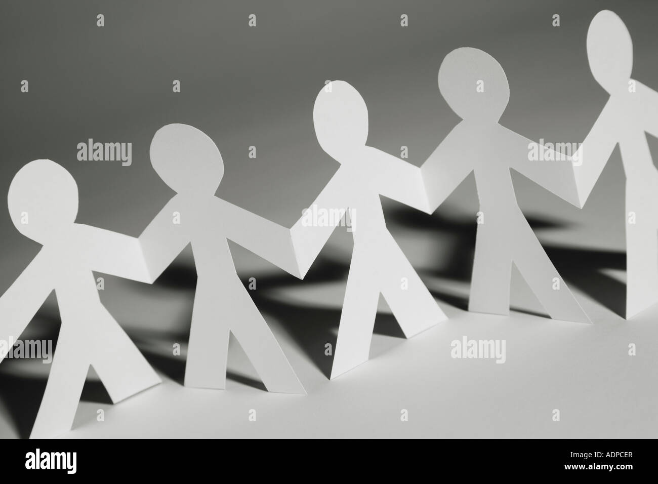 Paper cut outs of people Stock Photo - Alamy