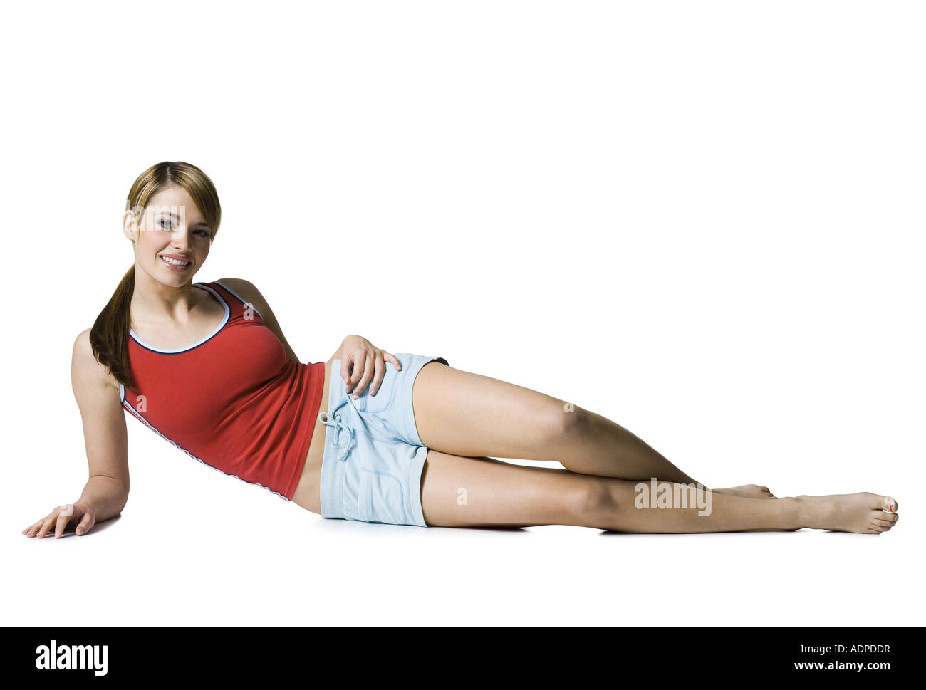 Woman lying down smiling Stock Photo - Alamy