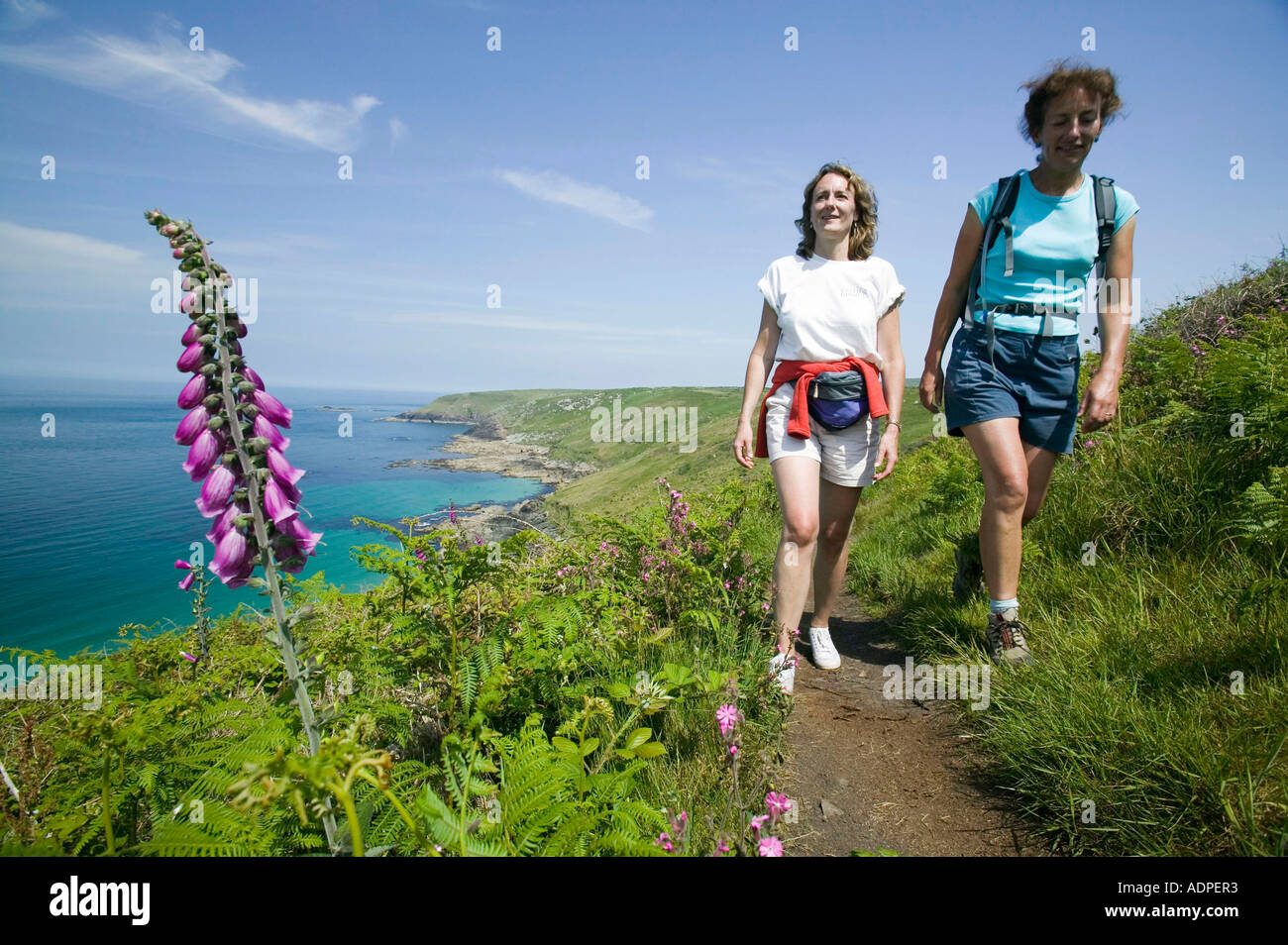 2 women walking along the South West coast Path near Zennor, cornwall ...