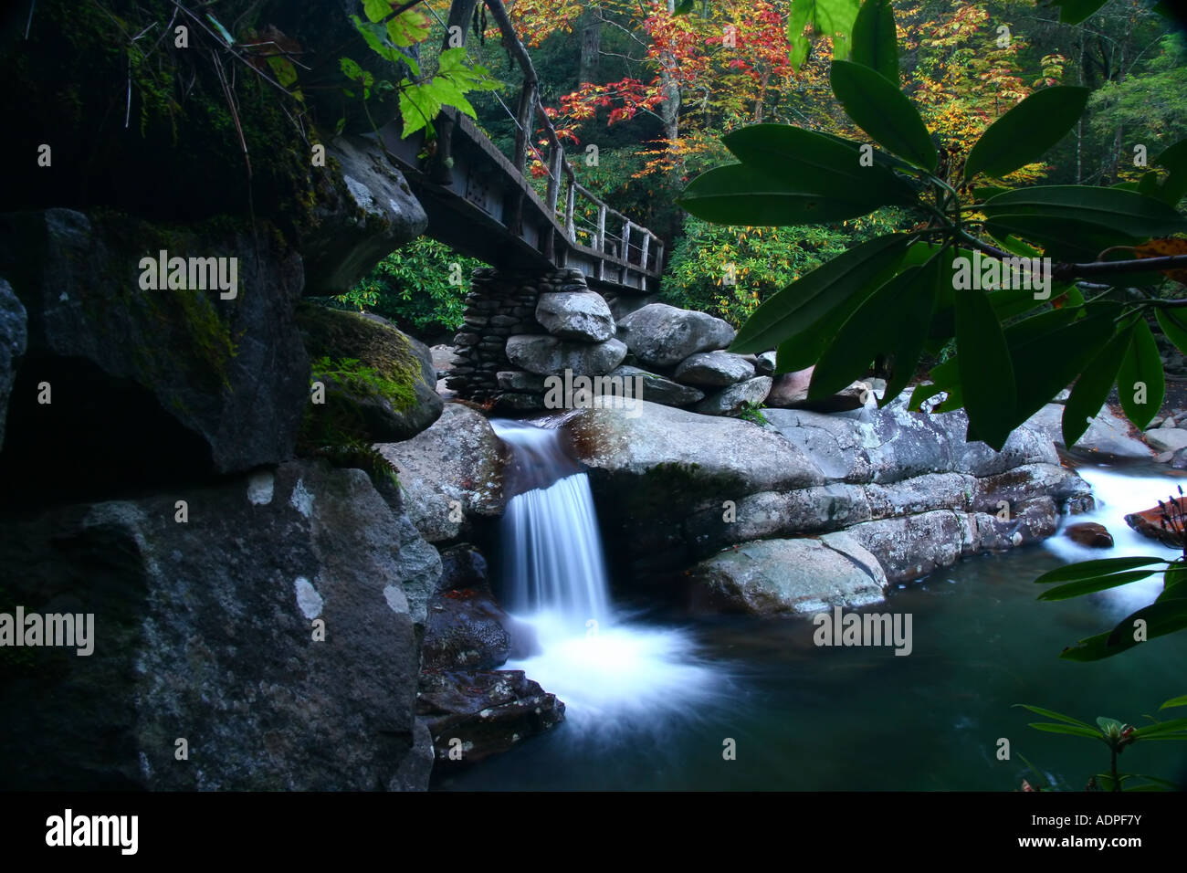 Bridge over waterfall Stock Photo - Alamy