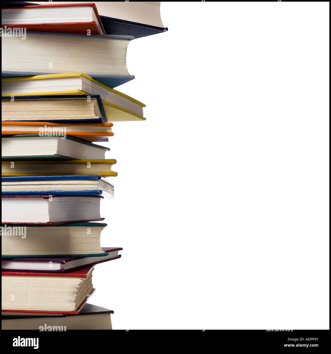 Tall pile of hardcover books Stock Photo - Alamy