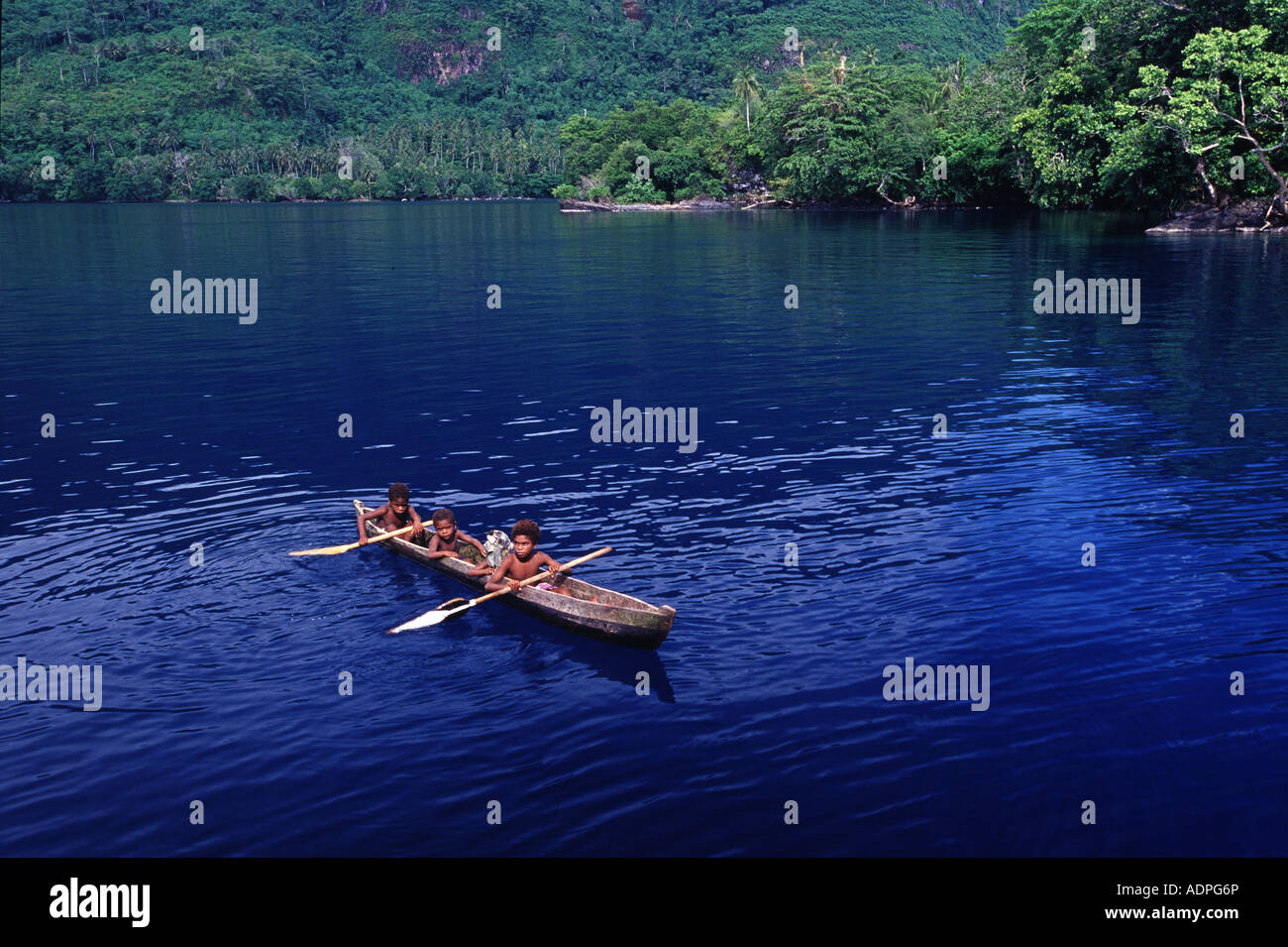 Papaun children kayaking small boat at vitu island, New britain,Papau ...