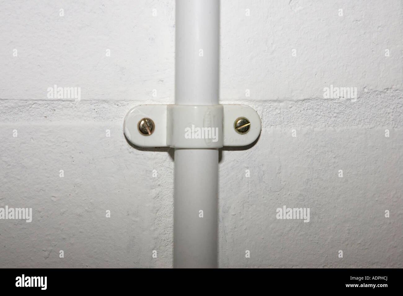 a cable ducting pipe fixed to a wall Stock Photo - Alamy