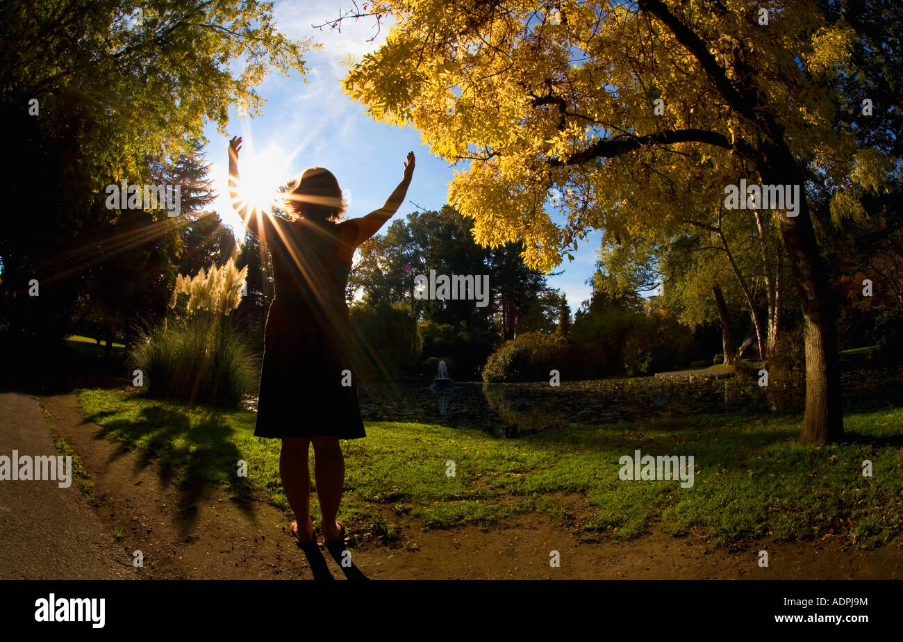 Woman praying outdoors Stock Photo - Alamy