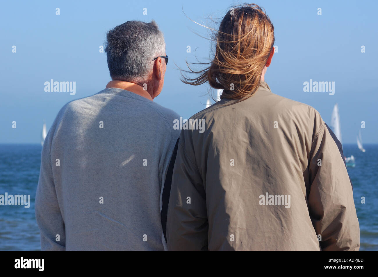 Couple watching sailboats hi-res stock photography and images - Alamy