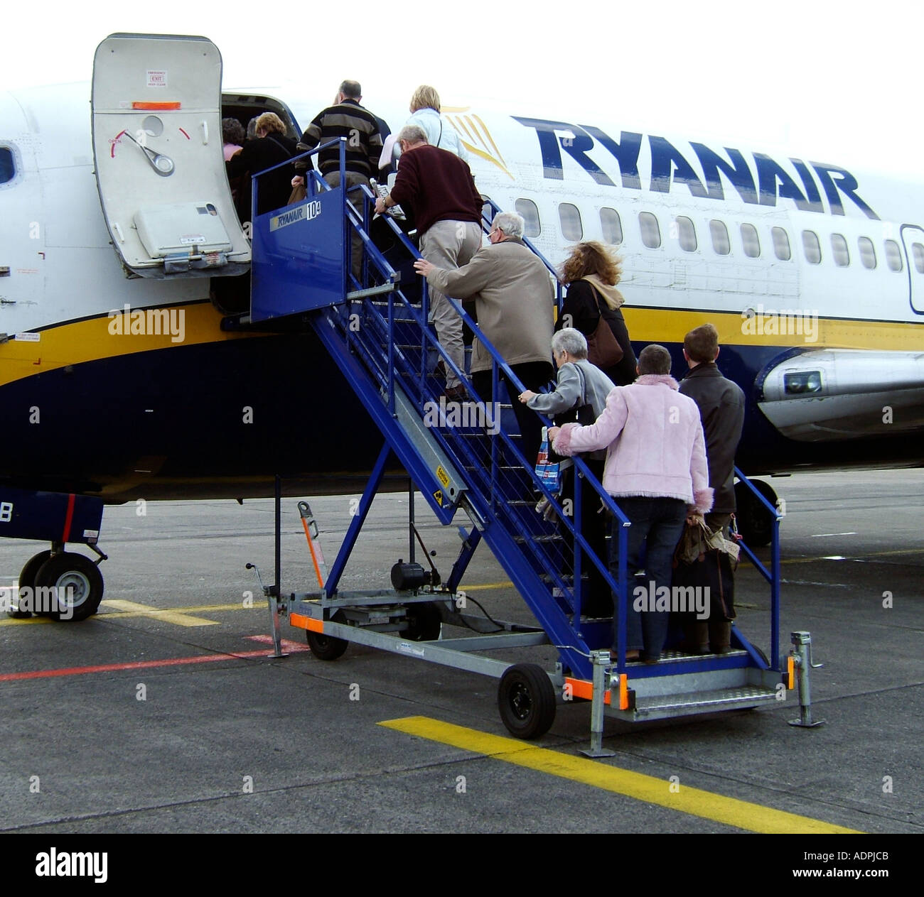 passengers boarding aeroplane Stock Photo - Alamy