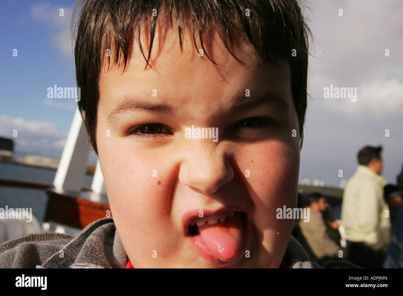 A eight year old boy having fun and being cheeky Stock Photo - Alamy