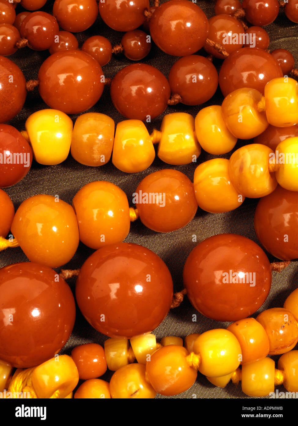 Different Coloured Amber Beads Stock Photo - Alamy