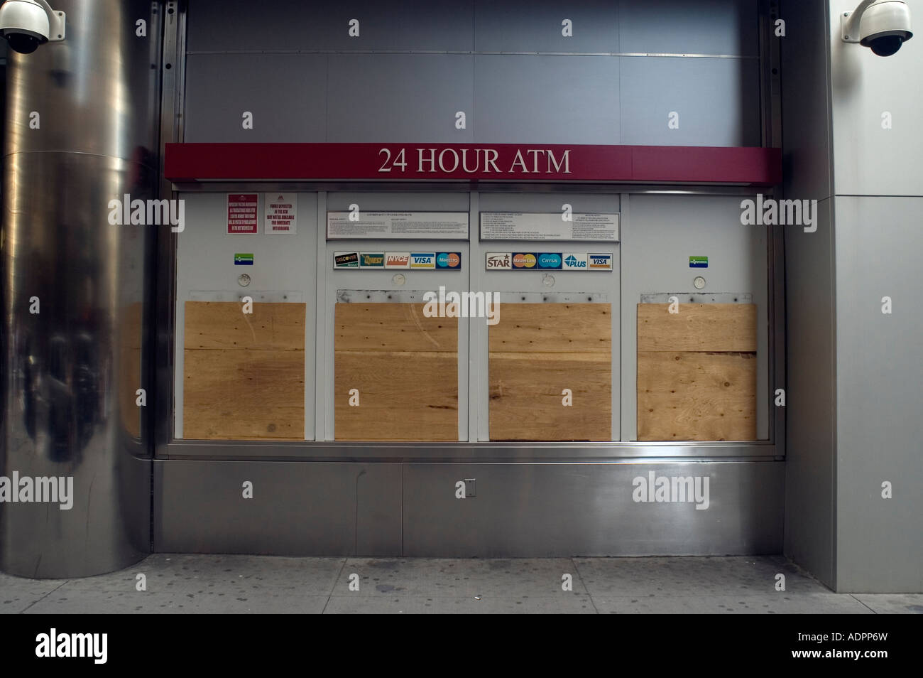 Closed and boarded up bank ATM machines on Lower Broadway in NYC Stock ...