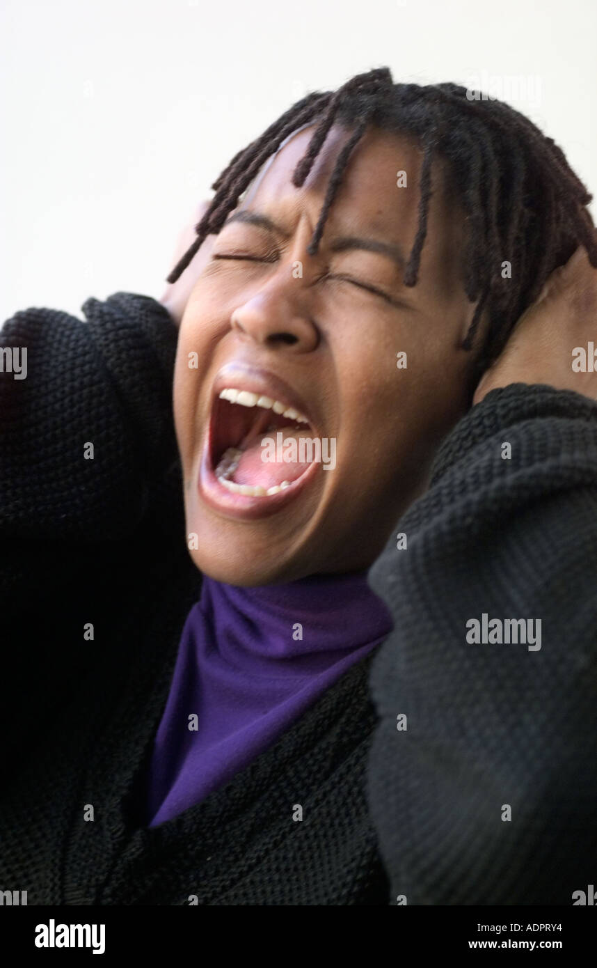 Black Woman Yelling Covering Ears Stock Photos & Black Woman Yelling ...