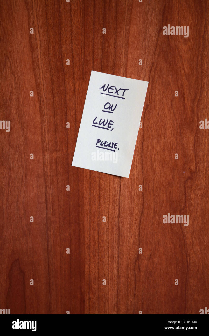 next on line please written on a post it note Stock Photo - Alamy