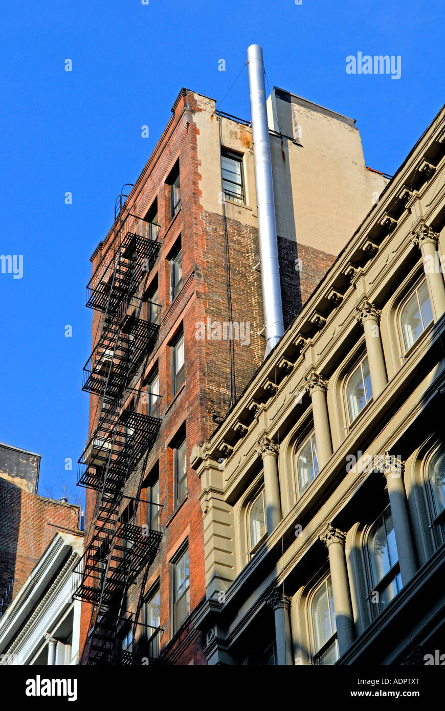 Urban apartment building with smokestack Stock Photo - Alamy