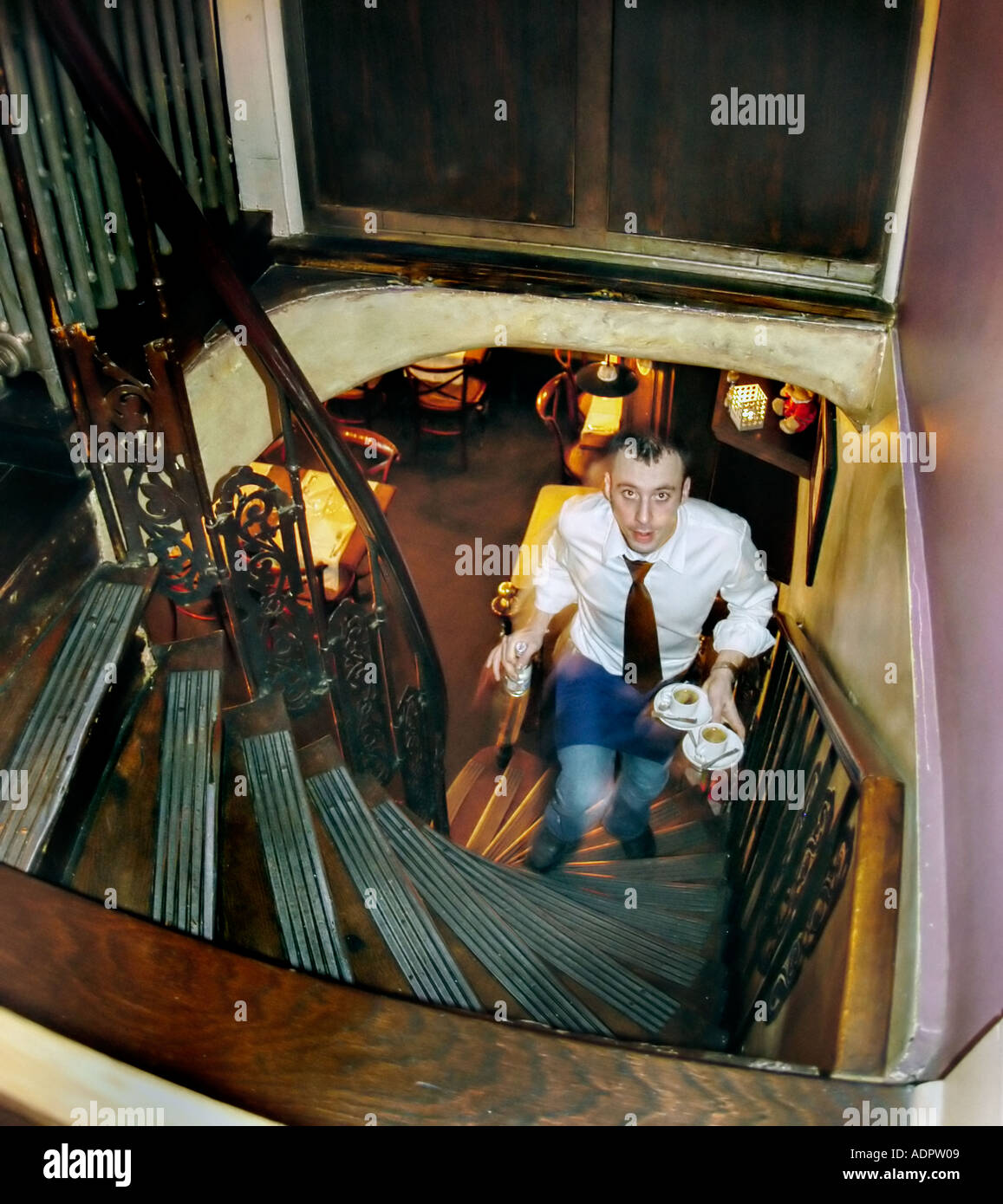 PARIS France, French Waiter Walking up Stairs in French Bistro ...
