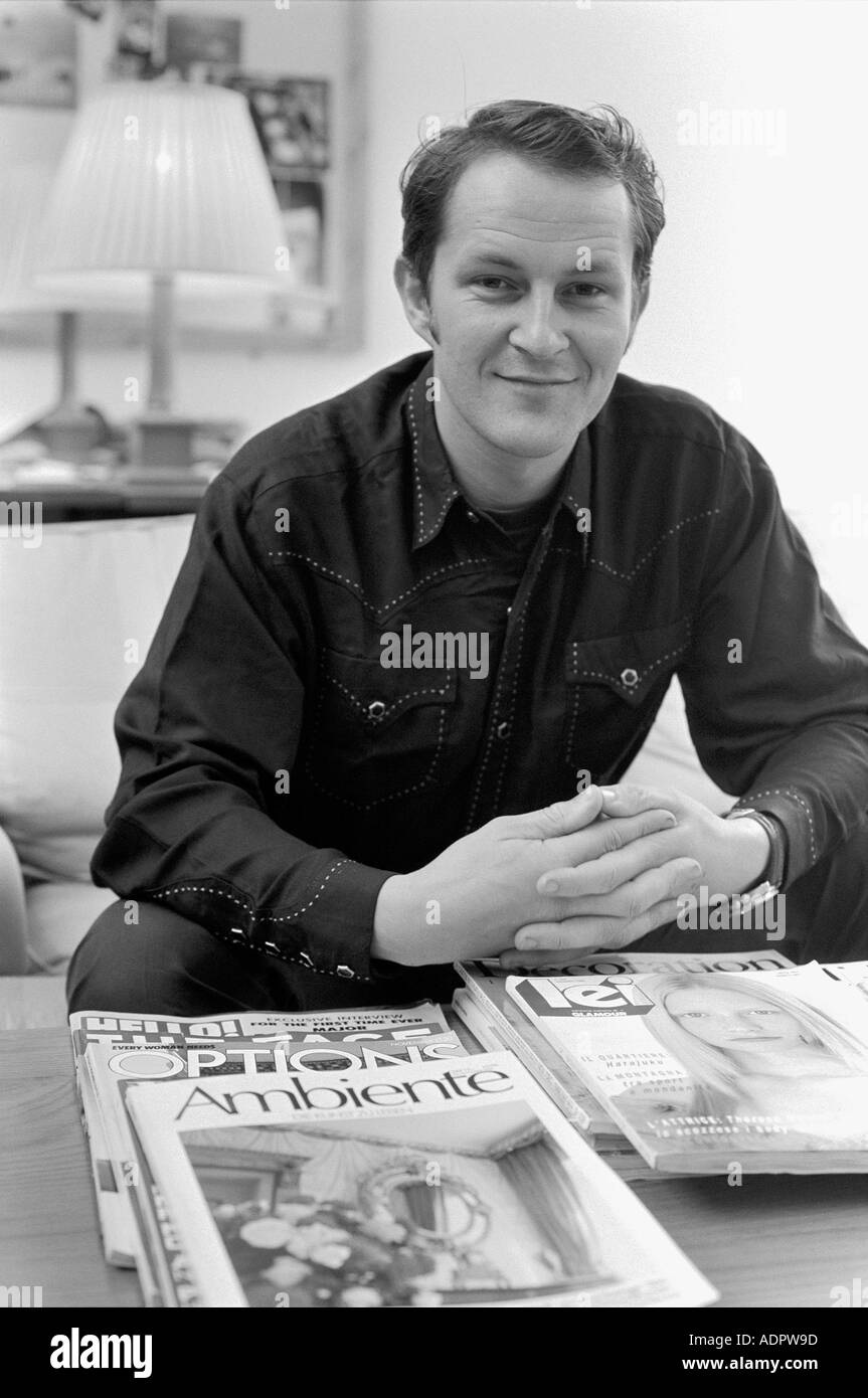 Nick Ashley Fashion Designer sitting in his office in London, UK Stock ...