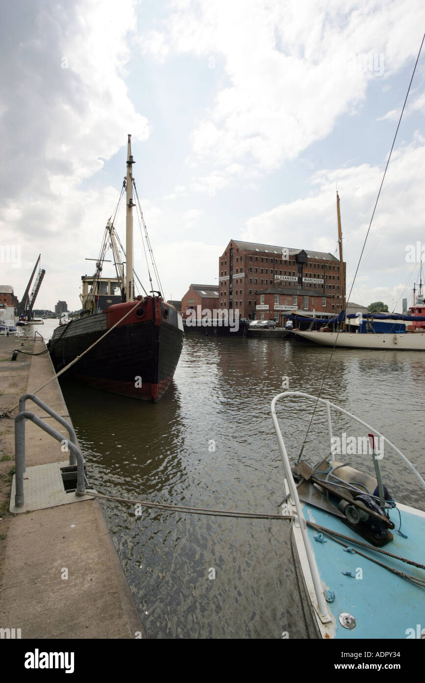Boats moored in Gloucester Docks with the Alexandra Warehouse behind ...