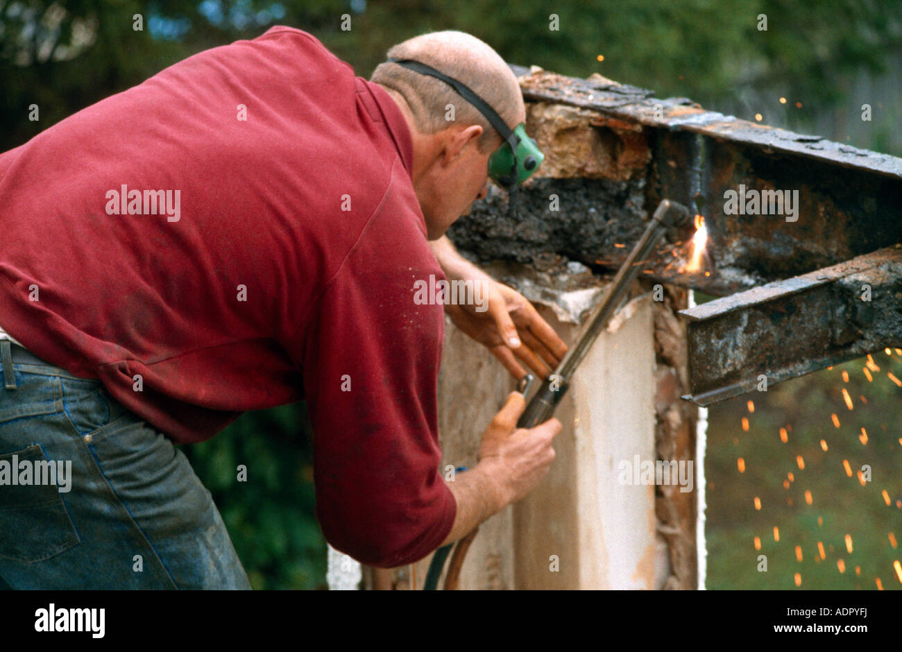 Workman Using Oxyacetylene Torch to Cut Metal Beam Whilst Demolishing ...