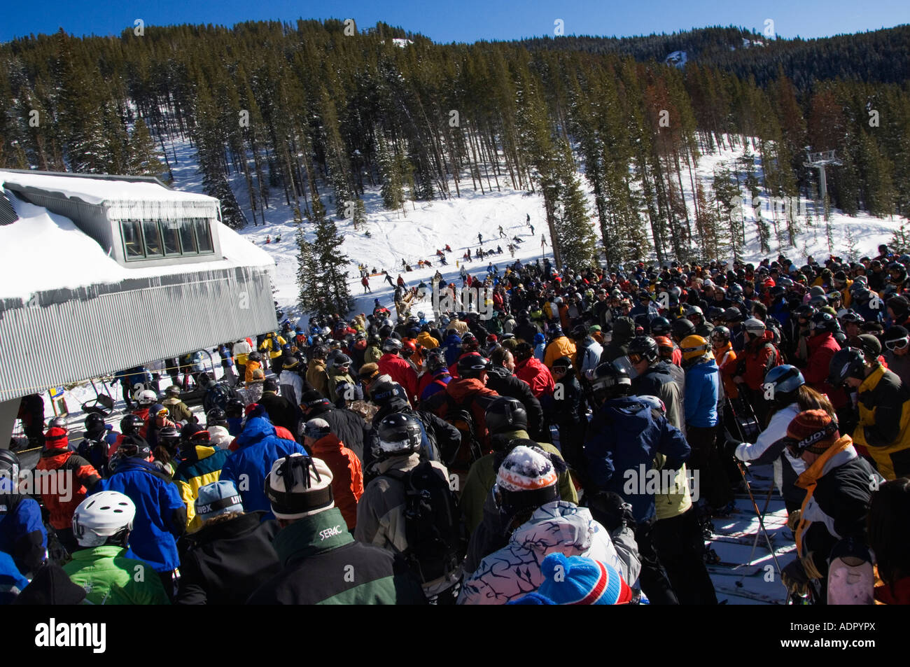 USA Colorado Vail Ski Resort Skiers waiting at a congested chair lift ...