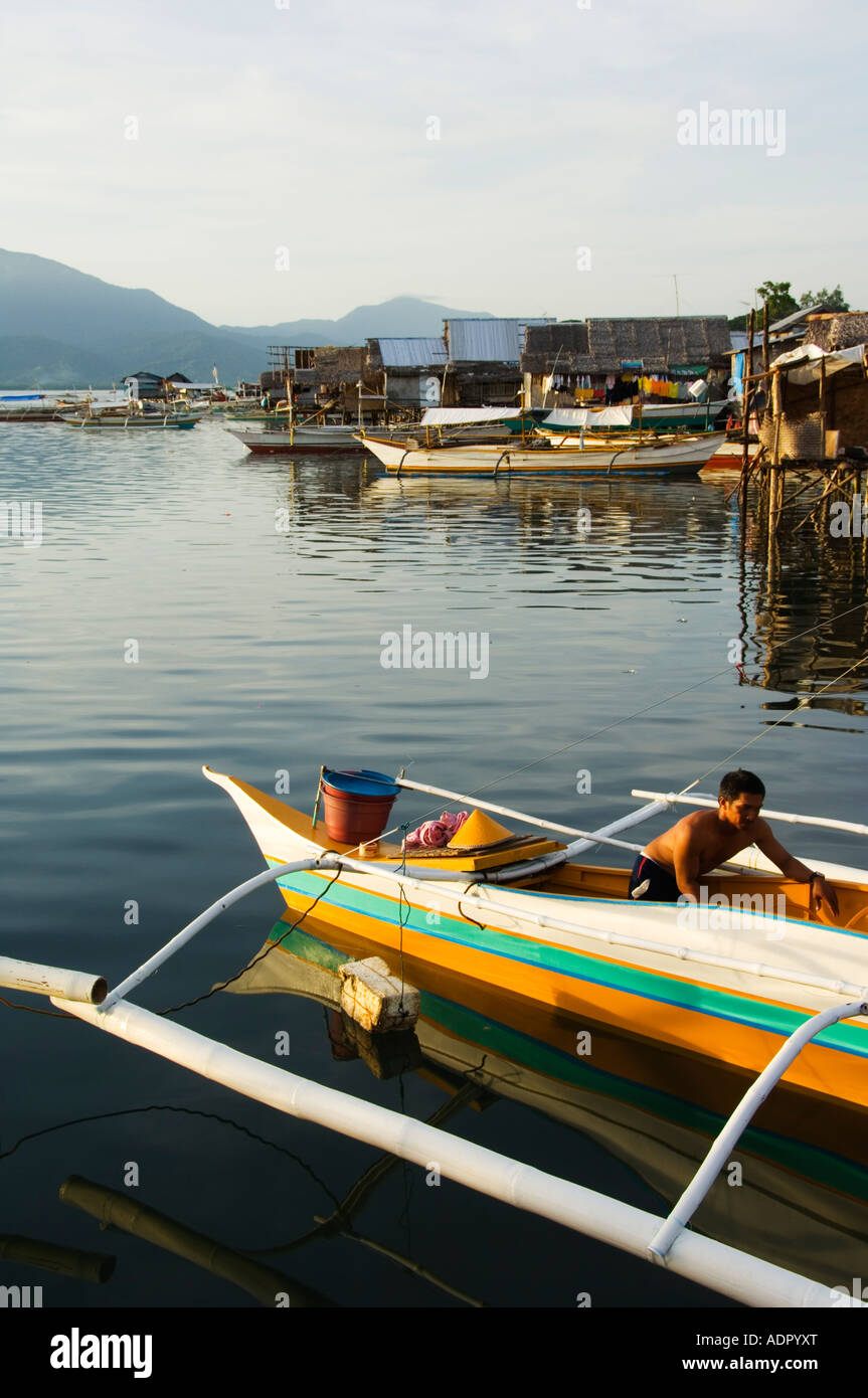 Philippines Luzon Palawan Puerto Princessa Fisherman on Colourful Banka ...