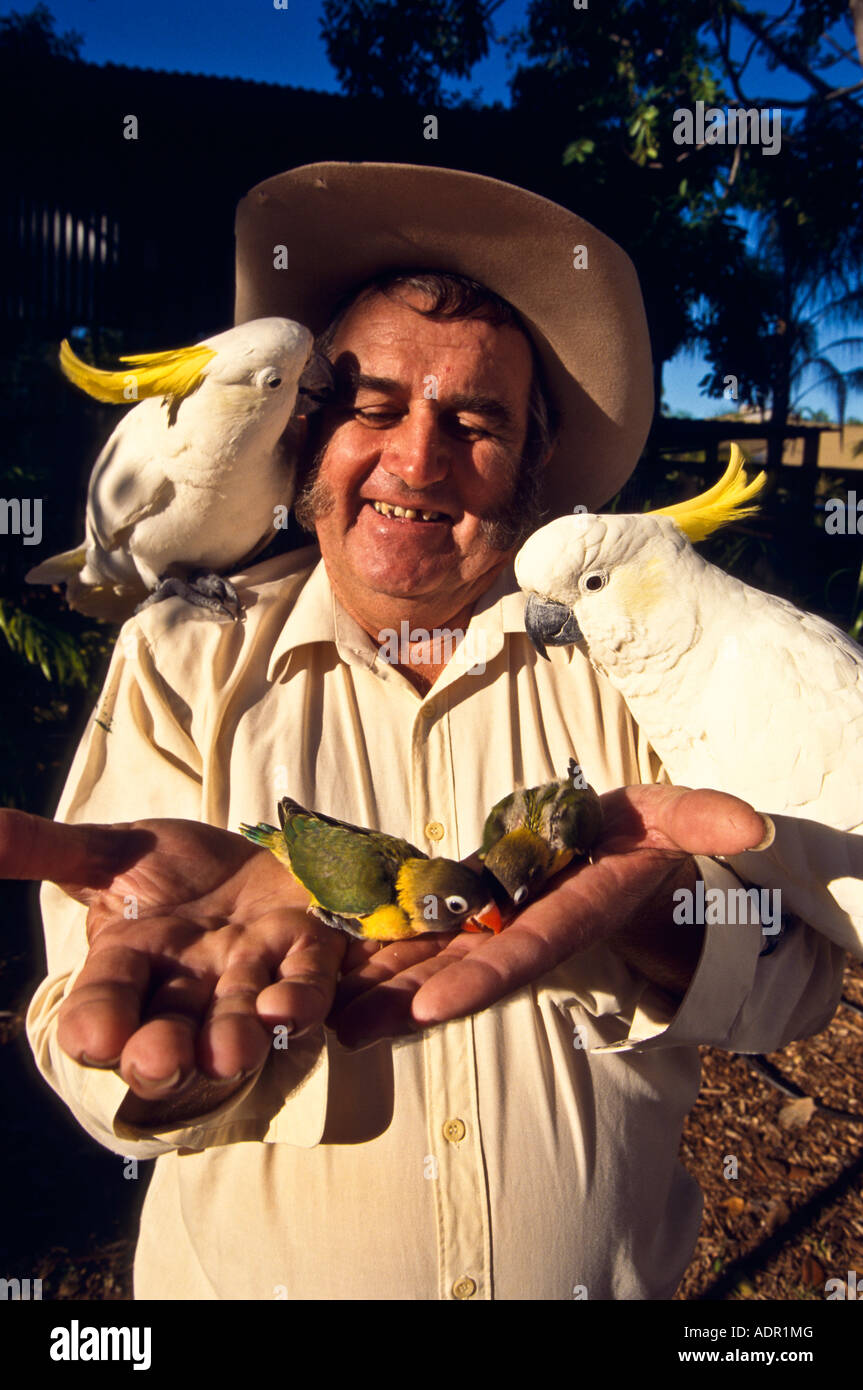 Man and pet birds Australia Stock Photo - Alamy