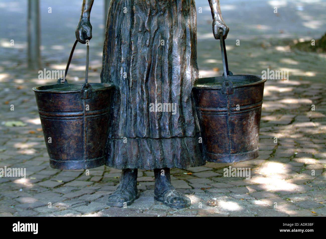 Woman carrying pails hi-res stock photography and images - Alamy