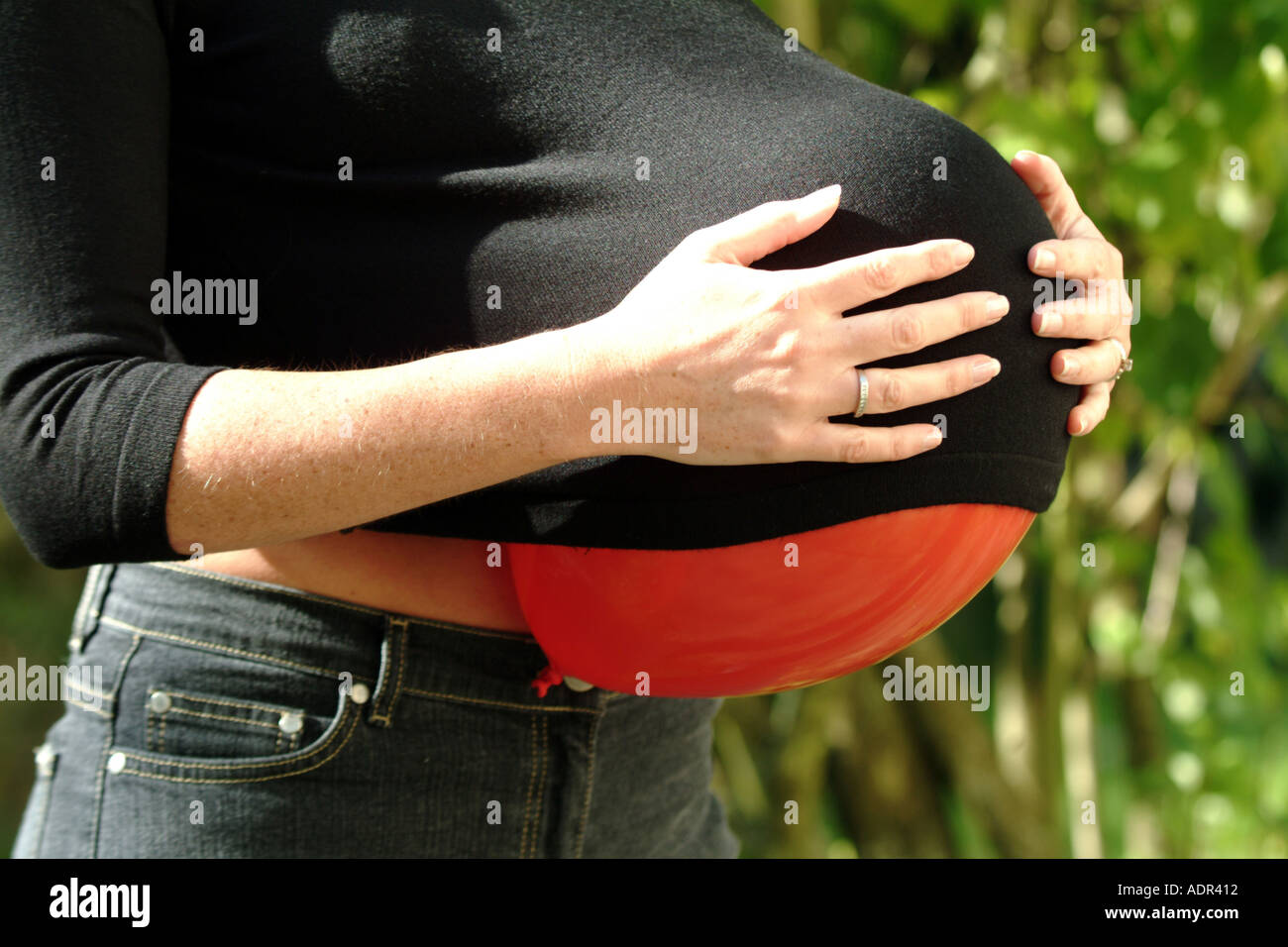 woman one 1 single red balloon stomach pregnancy pregnant conception ...