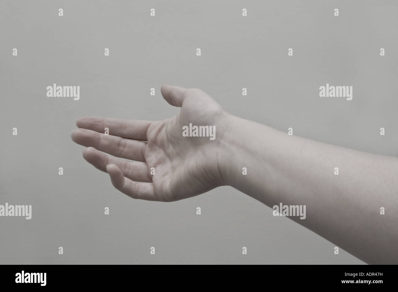 a pale arm with fingers extended Stock Photo - Alamy