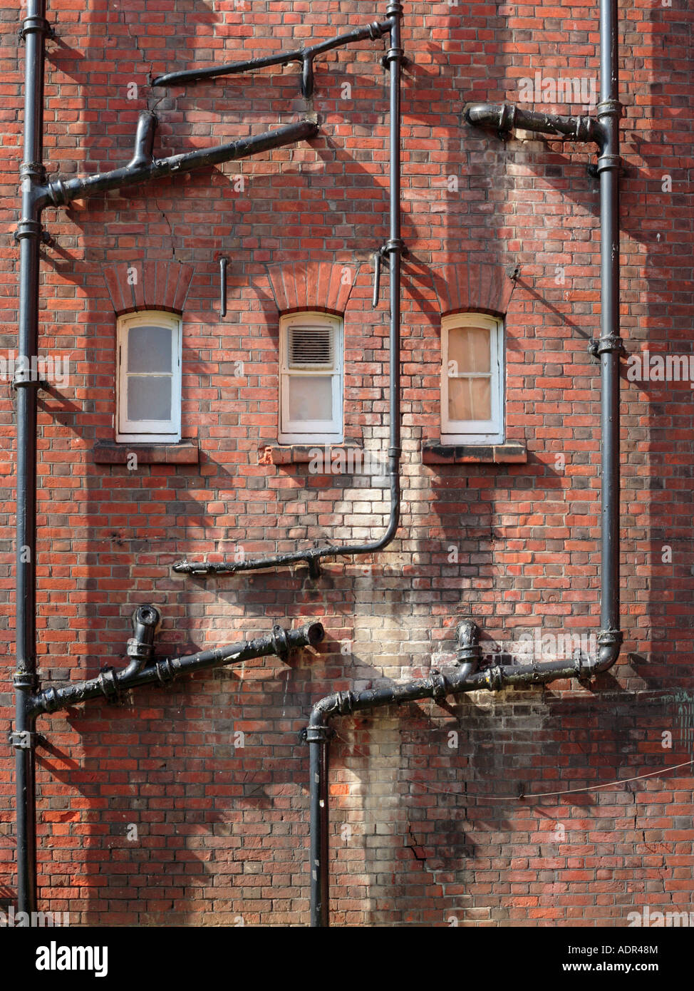 Pipe on brick wall hi-res stock photography and images - Alamy