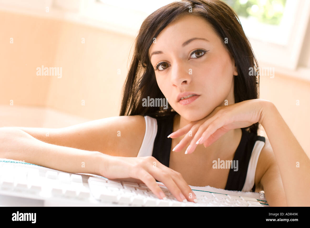 Girl sat at computer Stock Photo - Alamy