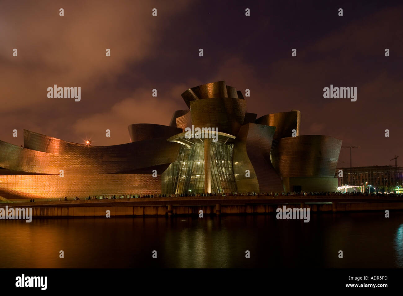 Guggenheim Museum at night illuminated by the light of fireworks Bilbao ...