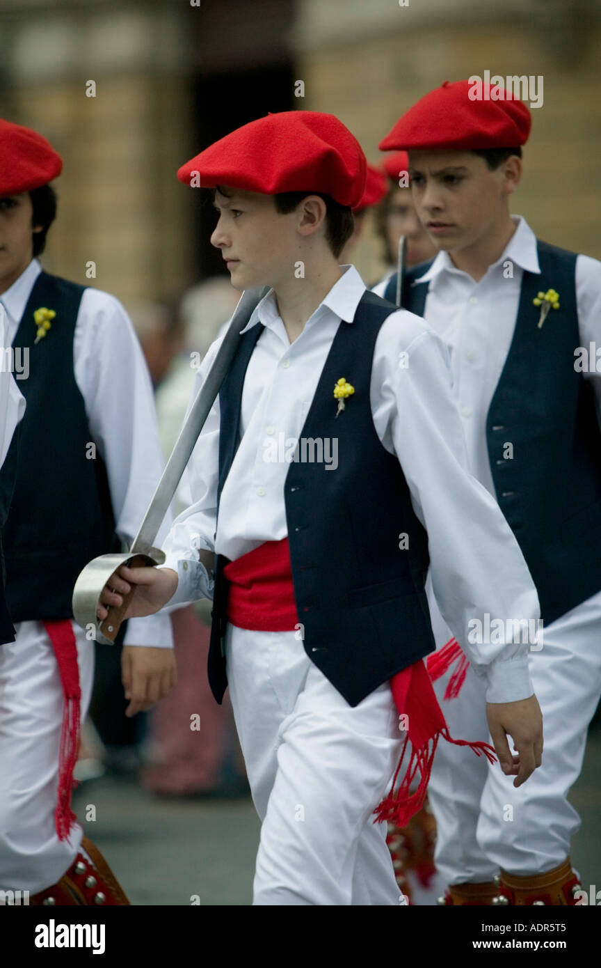 Boys wearing Basque beret the txapela and holding swords during Stock ...