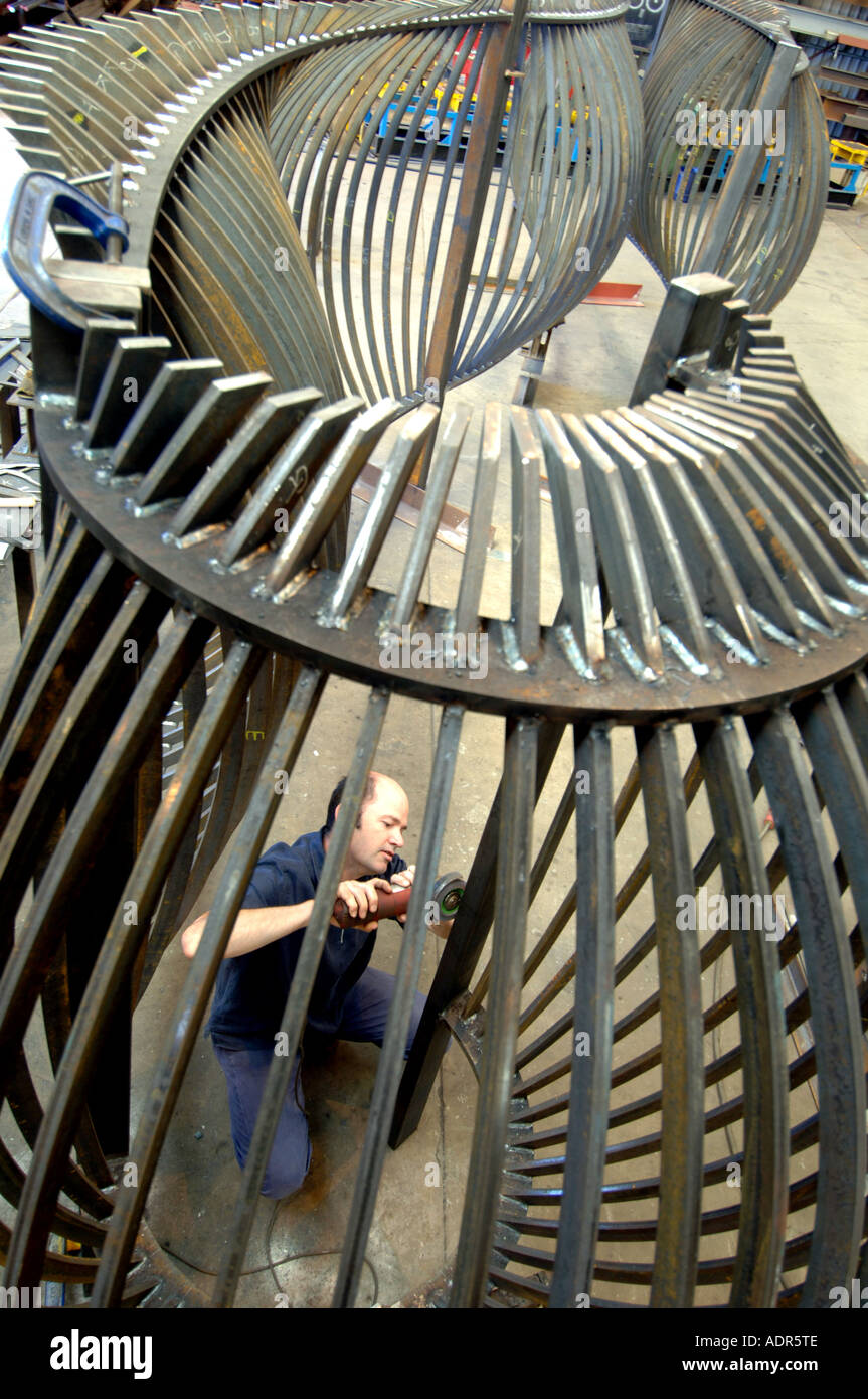 Sculptor Bruce Williams works on Springline a set of curvacious water ...