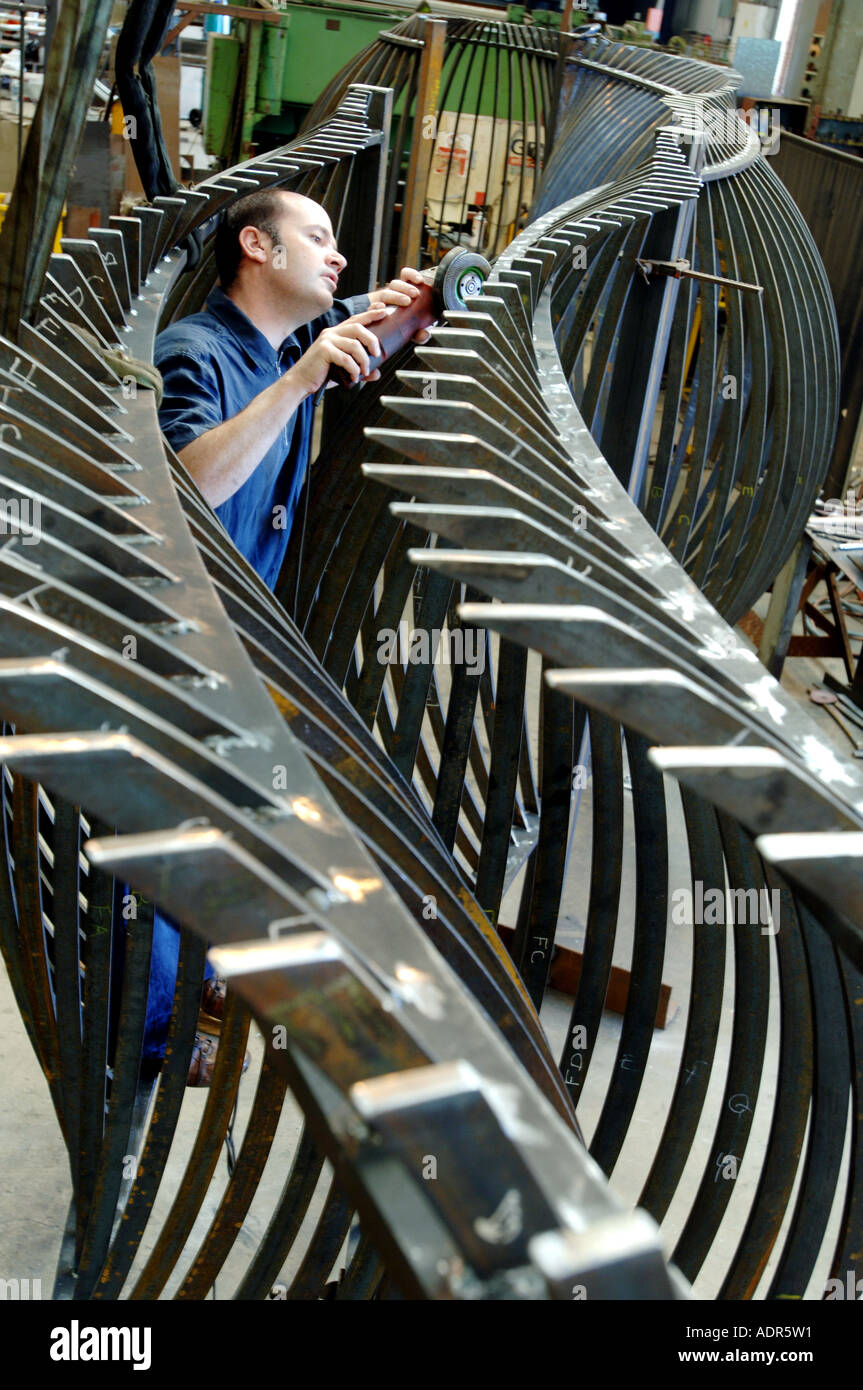 Sculptor Bruce Williams works on Springline a set of curvacious water ...