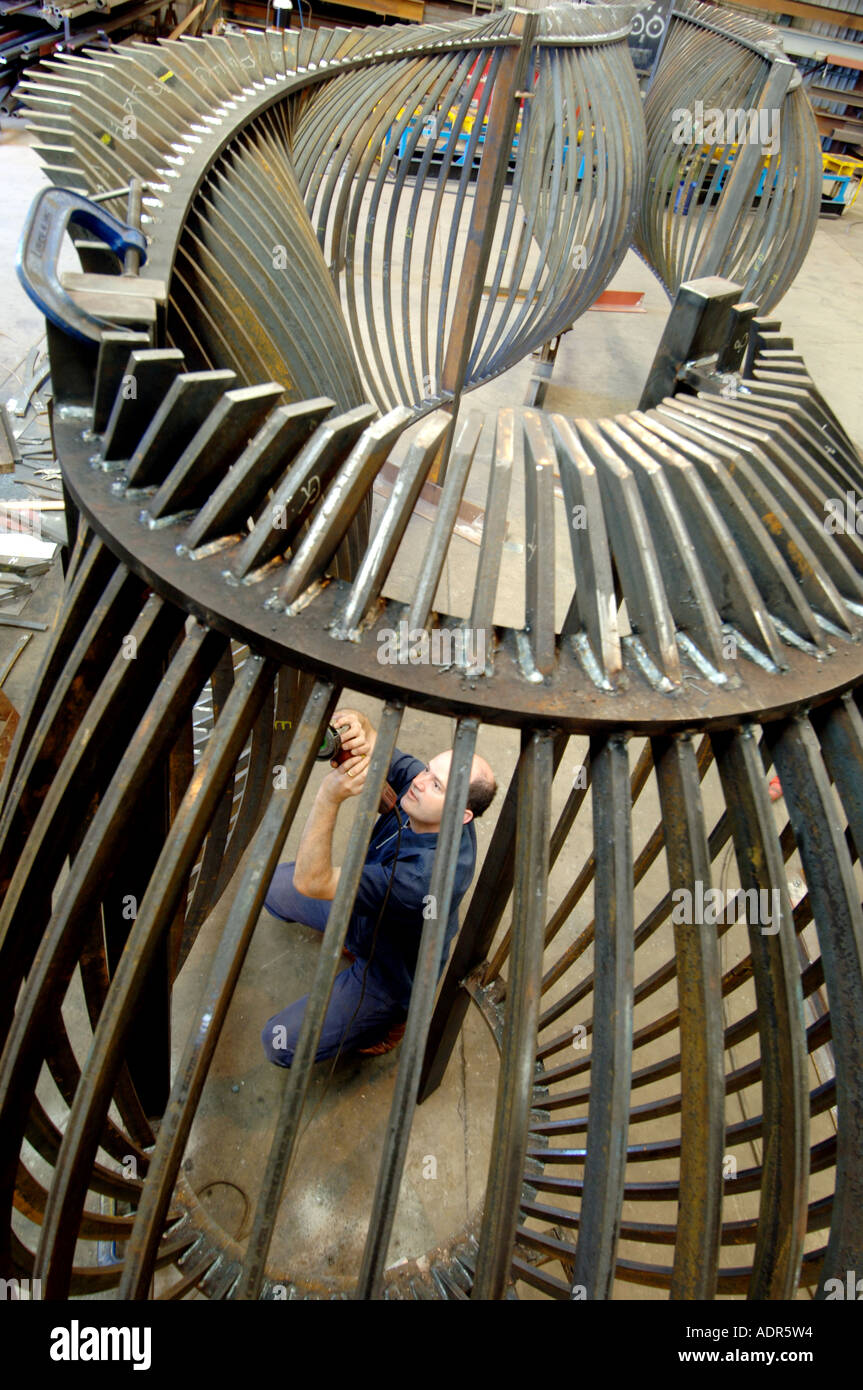 Sculptor Bruce Williams works on Springline a set of curvacious water ...