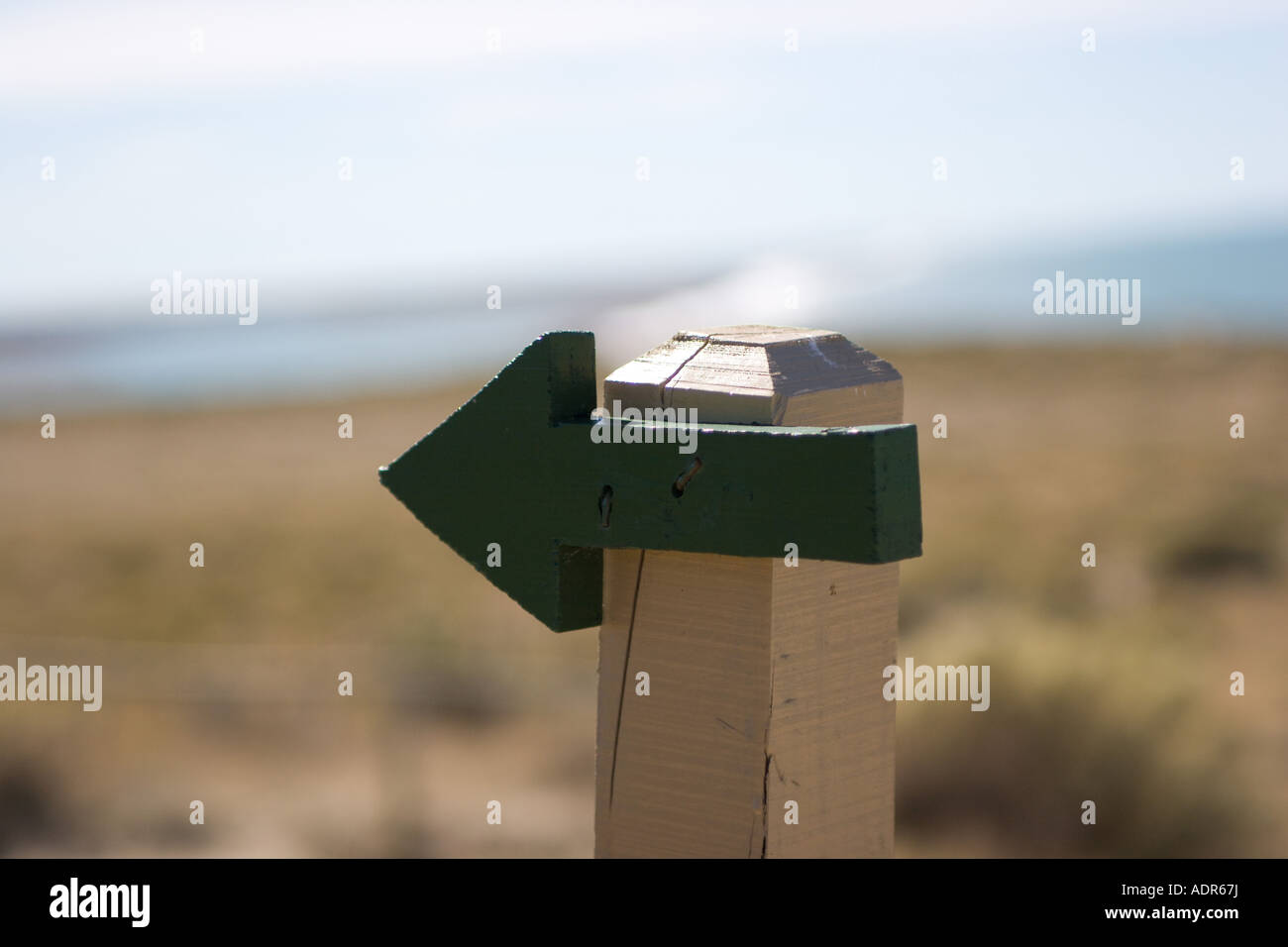 Turn left wooden sign Stock Photo - Alamy