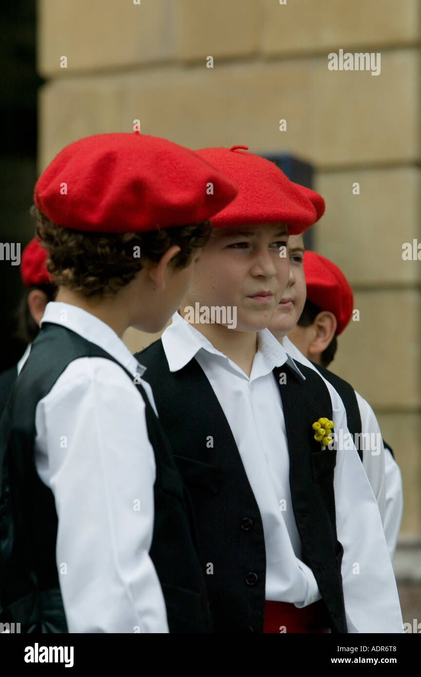 Young Basque boys wearing the red txapela during Basque folk dances ...