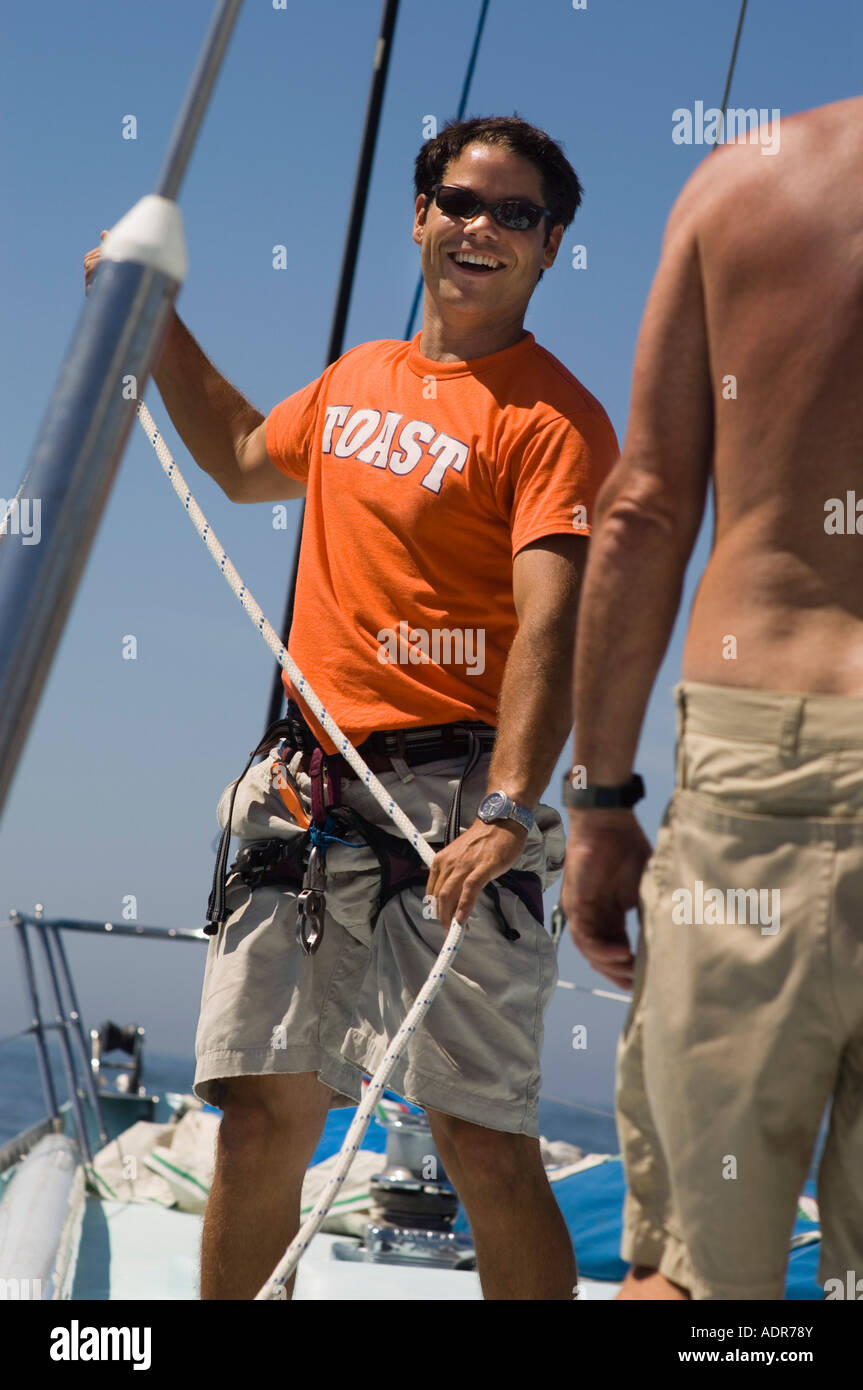 Smiling Sailor Working Ropes on Yacht, portrait Stock Photo - Alamy