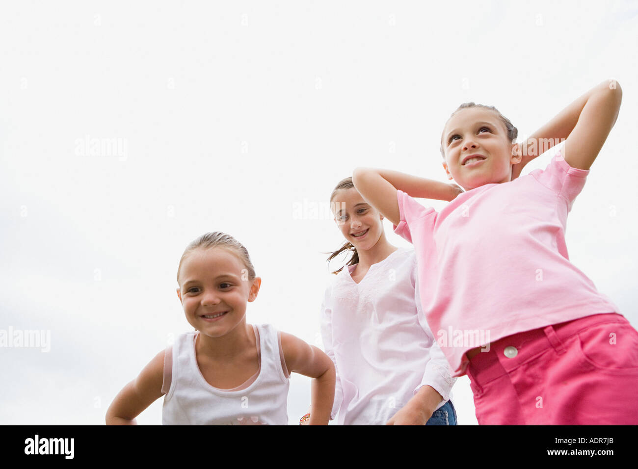 Three girls playing Stock Photo - Alamy