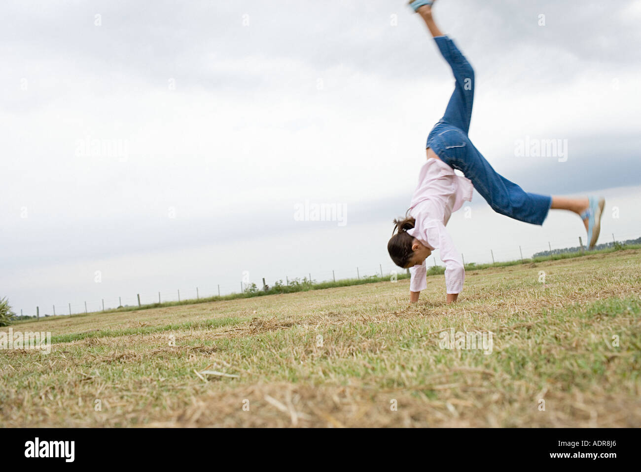 Cartwheel children playing hi-res stock photography and images - Alamy