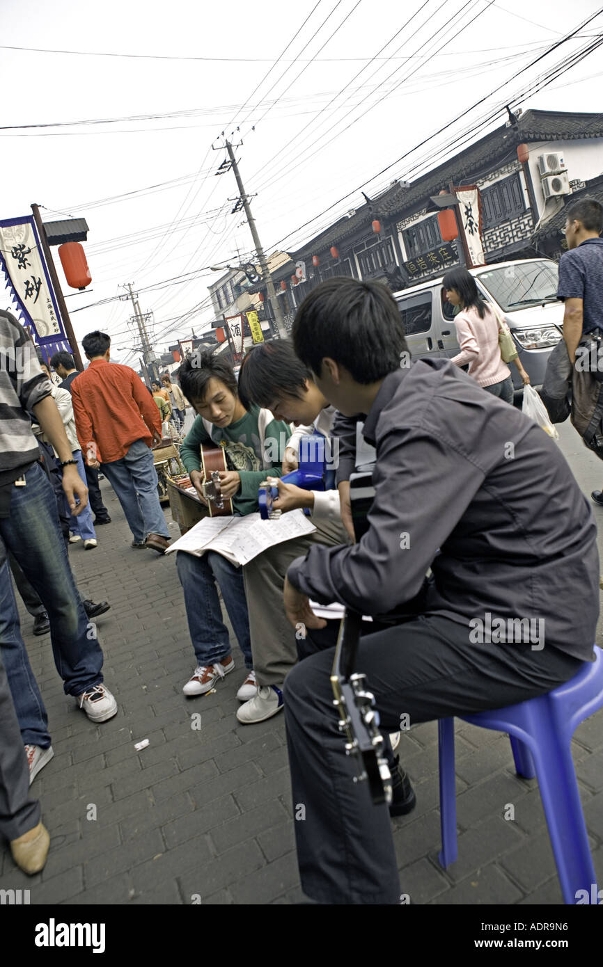 CHINA SHANGHAI Chinese teens practice playing their guitars on a ...