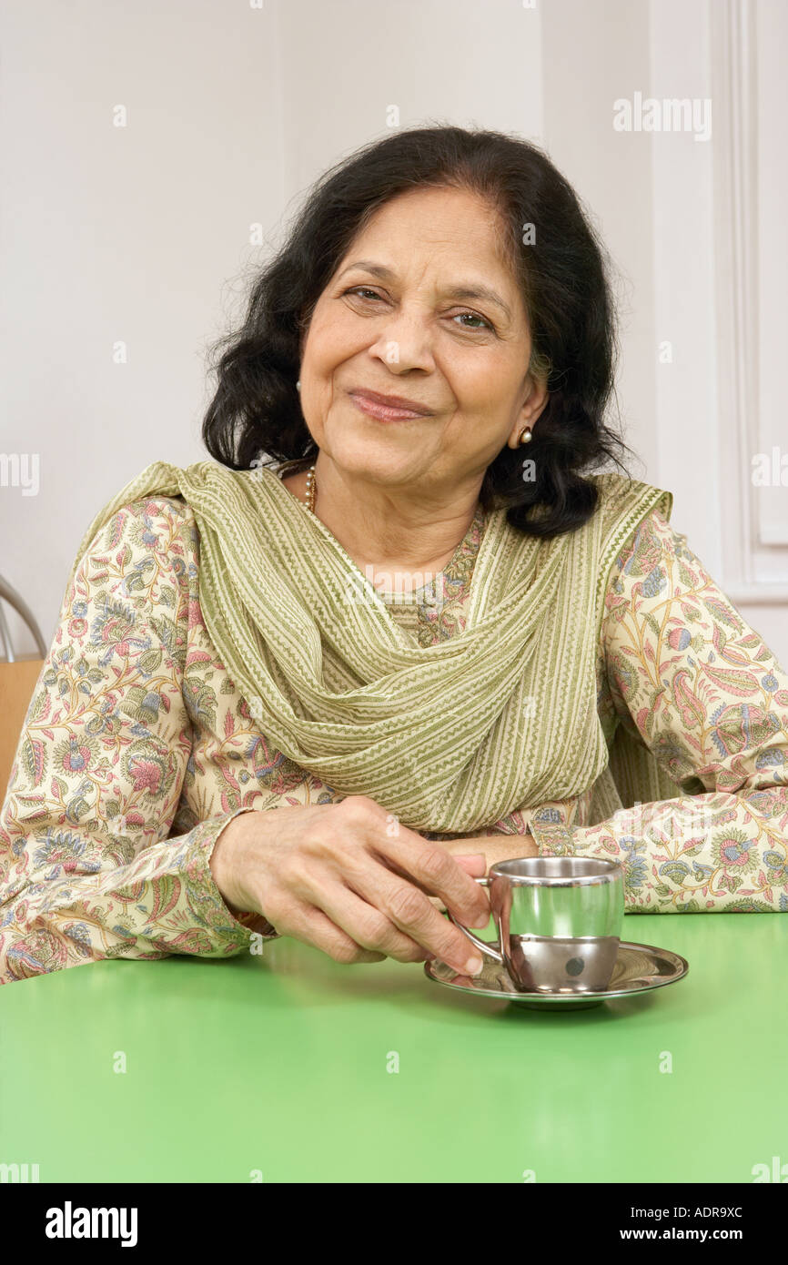 Senior woman indian one person kitchen hi-res stock photography and ...