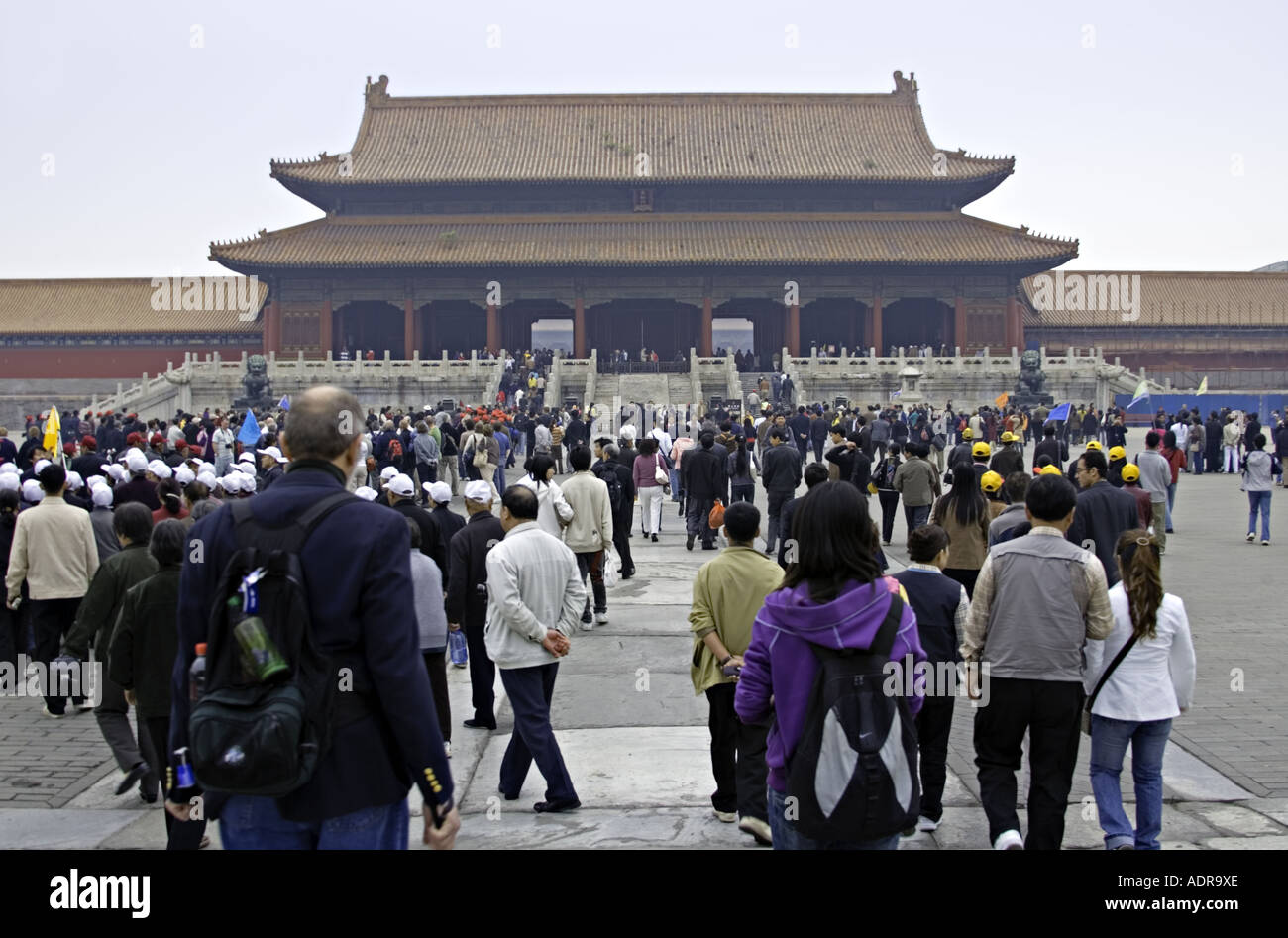 CHINA BEIJING Crowds of Chinese tourists in matching baseball caps ...