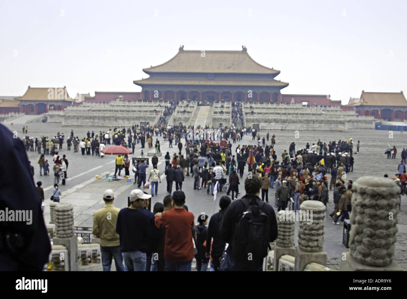 CHINA BEIJING Crowds of Chinese tourists follow their tour guides flags ...