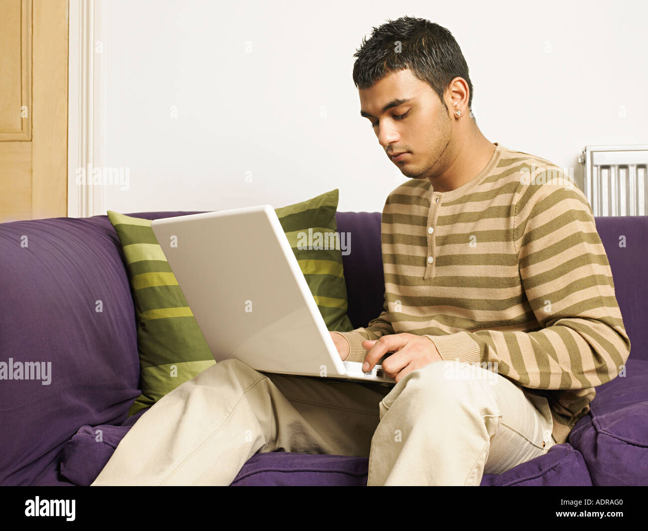 Man using a laptop computer Stock Photo - Alamy