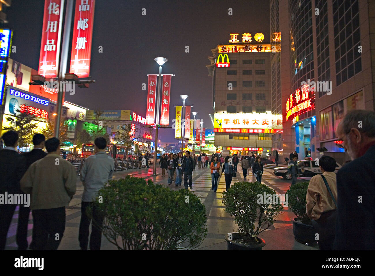CHINA BEIJING Night scene of crowded shopping street Wangfujing Dajie ...